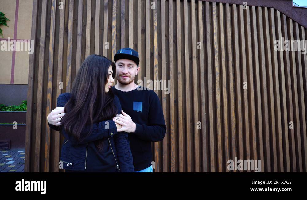 Girl is Closer to Camera, Guy Behind It. Newlyweds Holding Hands and ...