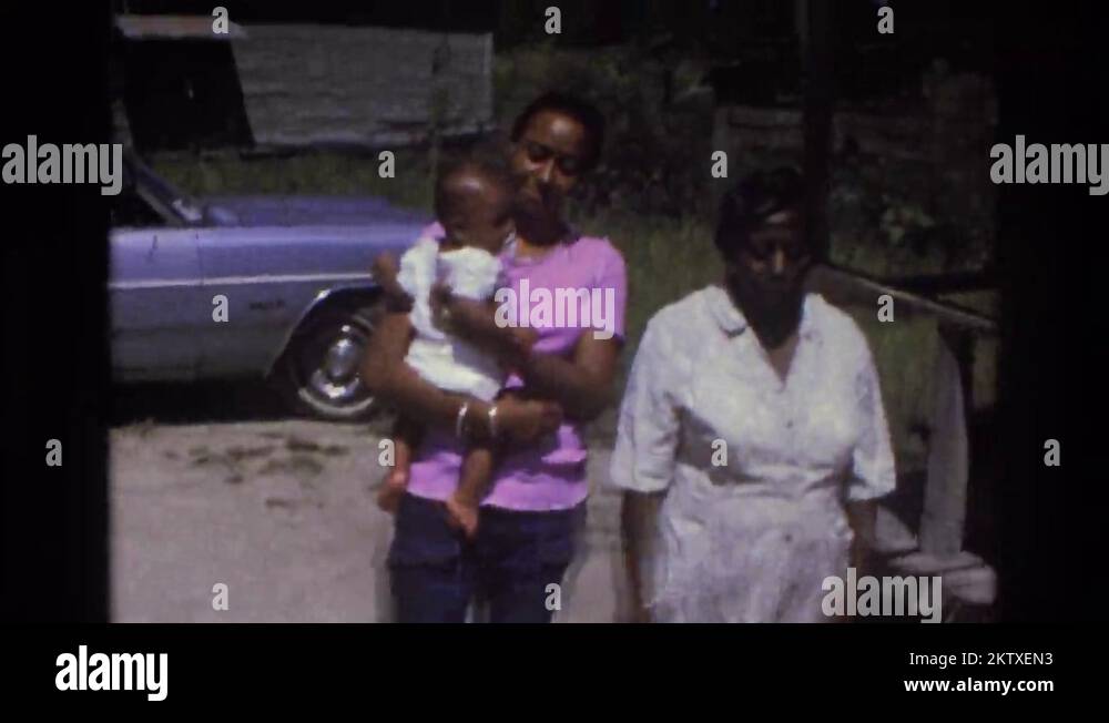 1975: family posing for a picture outside. ATLANTA GEORGIA Stock Video ...