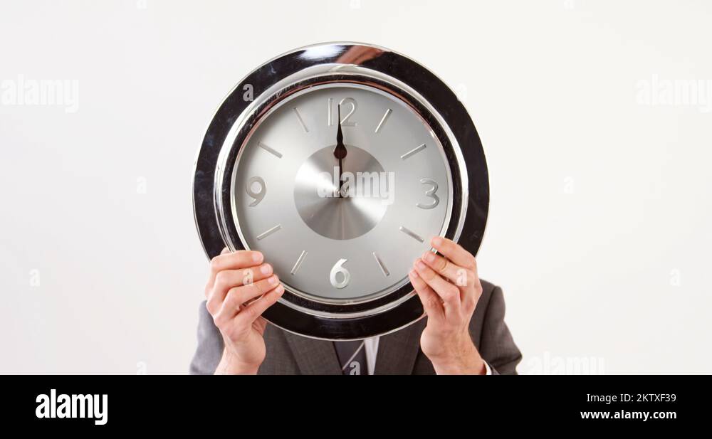 Man holding clock Stock Videos & Footage - HD and 4K Video Clips - Alamy