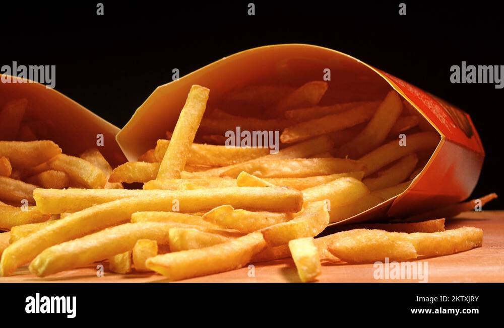 Paper boxes with french fries. Popular fast food deep fried potato. 4K ...