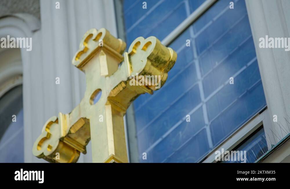 Golden cross on top of the entrance to the church Stock Video Footage ...