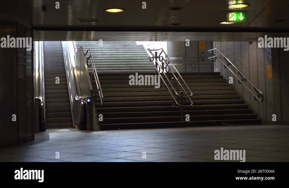 Stairway into train station with escalator going up Stock Video Footage ...
