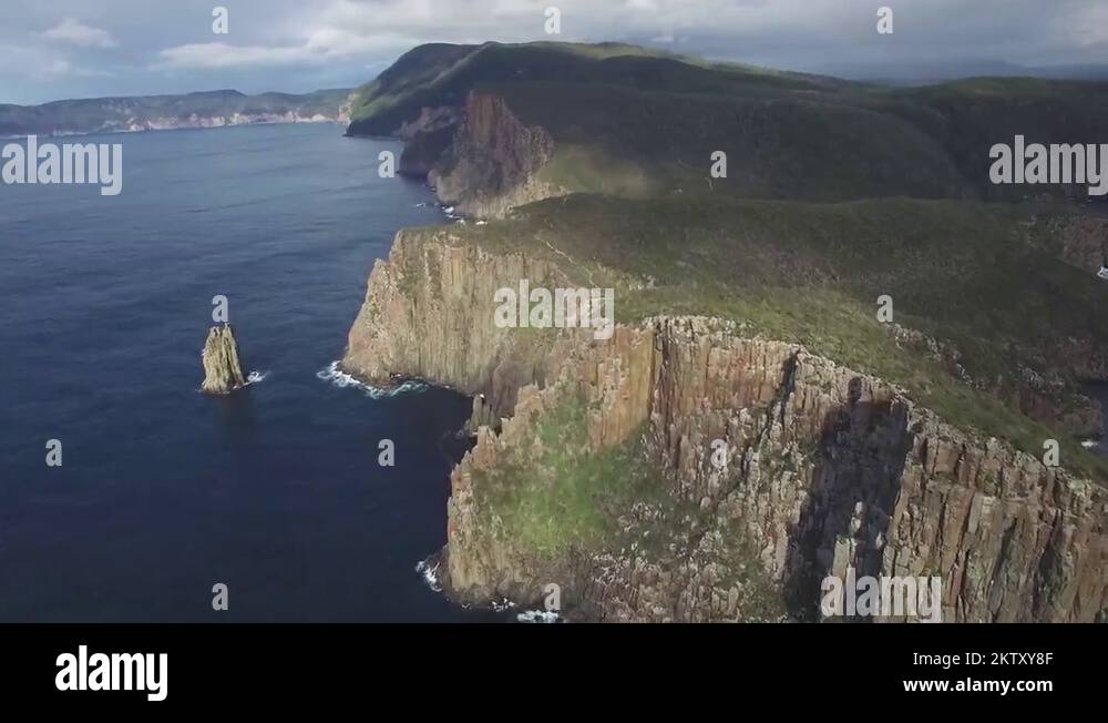 Flying towards and over rugged cliffs of Cape Hauy in Tasman National ...