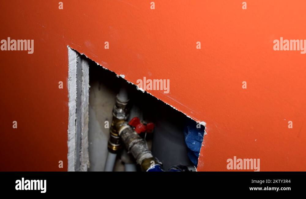 Installing inspection window in plasterboard wall Stock Video Footage - Alamy