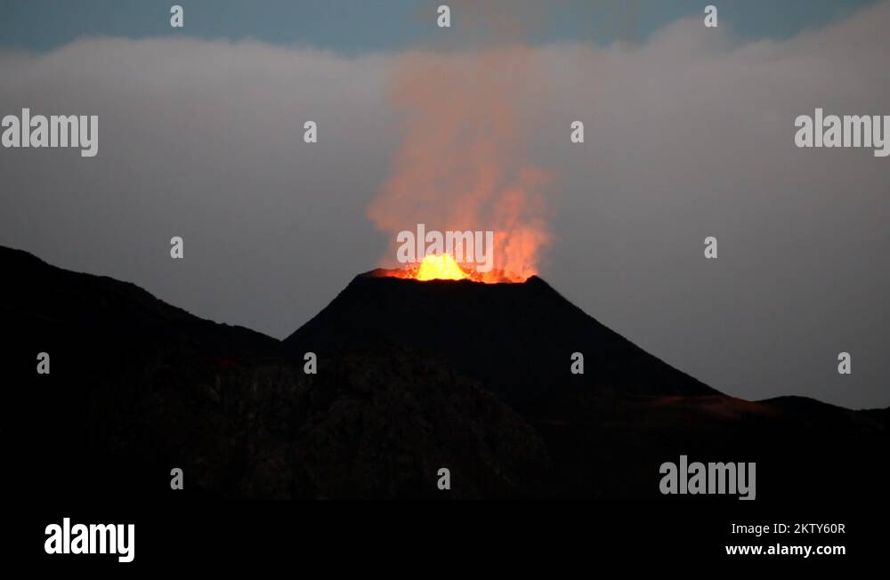 La Reunion Piton de la Fournaise volcano eruption at night with ...