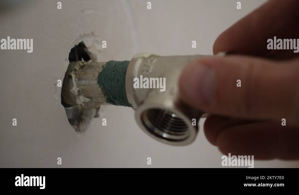 Screwing up manually a T-joint pipe fitting onto pipe Stock Video ...