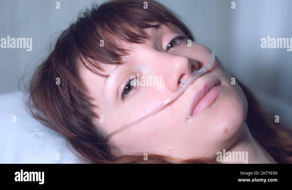 4k Hospital Shot of Sick Woman with Nasal Breathing Tube, dolly camera ...