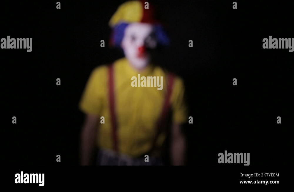Scary clown screaming into camera faces. Close-up Stock Video Footage ...