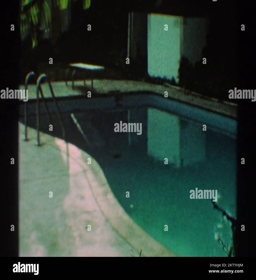 1969: panning camera view of creepy old pool. LOS ANGELES CALIFORNIA ...