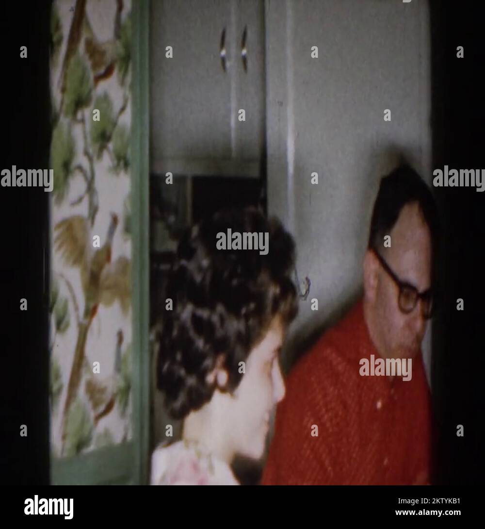 1959: family sitting around a table and having happy birthday being ...