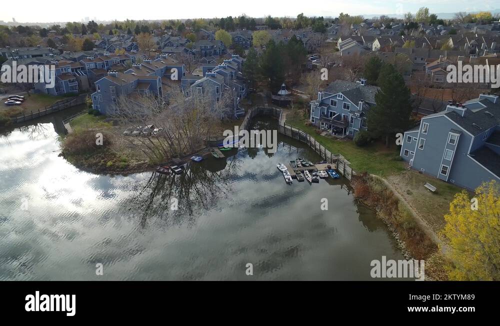 large, tall house lining a shore line with streets connecting the ...