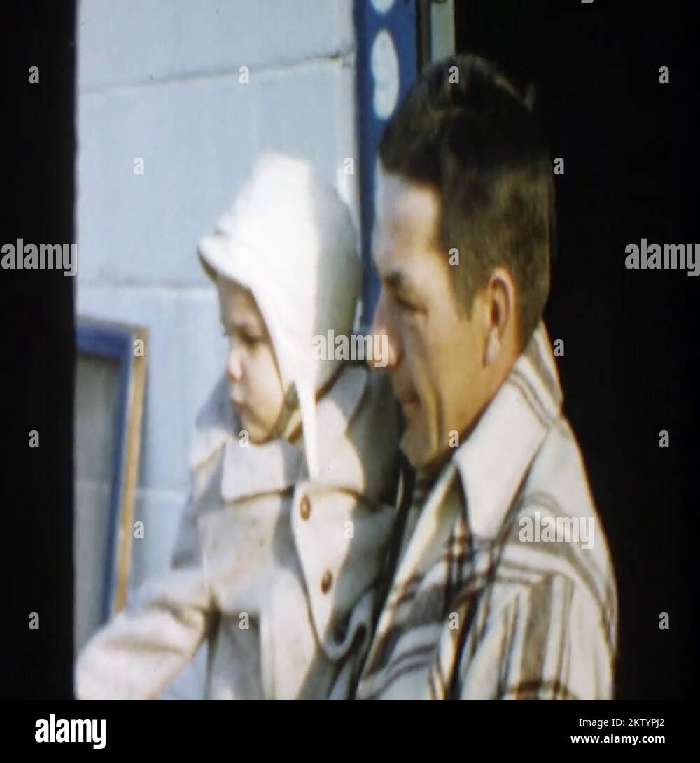 1958: a dad with his cute kid stepping out his house to go for a ...