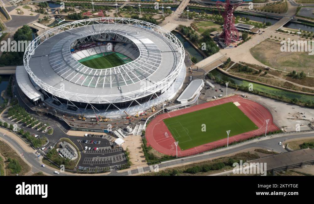london city aerial helicopter flight urban skyline football stadium ...