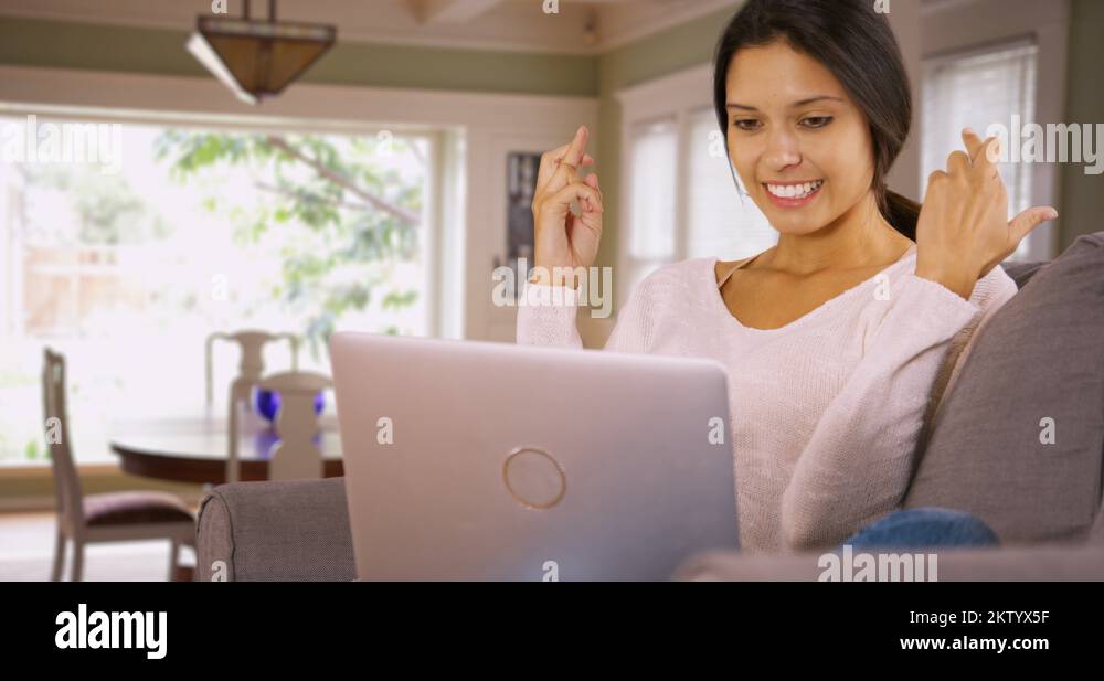 Young white girl gets excited watching the game on her laptop Stock ...