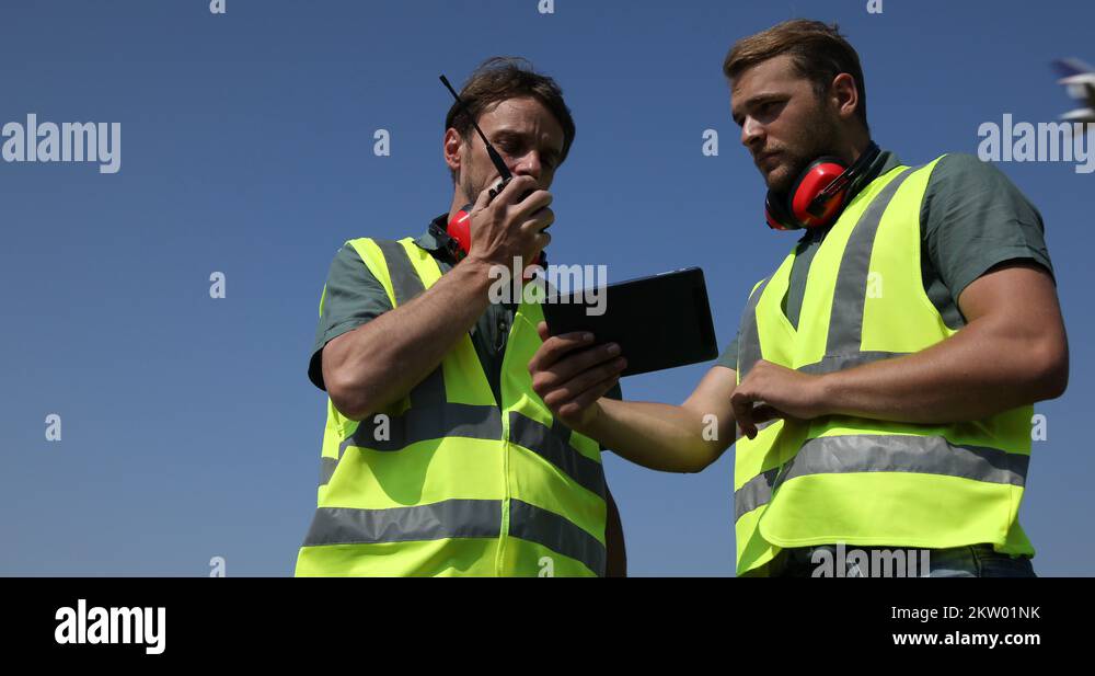 Airport Employee Talk Two Way Walkie Talkie Holding Transceiver Radio ...
