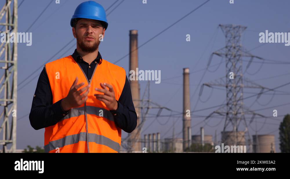 Engineer Man Talking About Power Plant Electric Tower Energy Production ...
