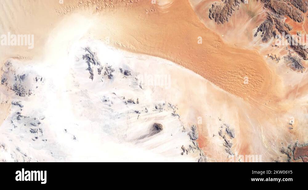 High-altitude overflight aerial of sandy terrain and dunes in the Namib ...