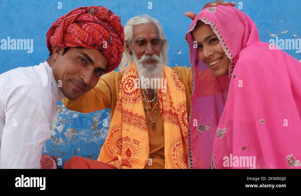 Indian holy man, Sadhu, hands raised and blessing a couple with folded ...