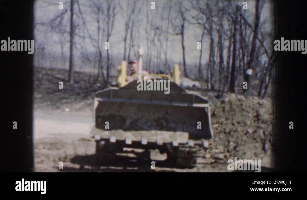 1959: man working on jcb levelling the ground, power of technology ...