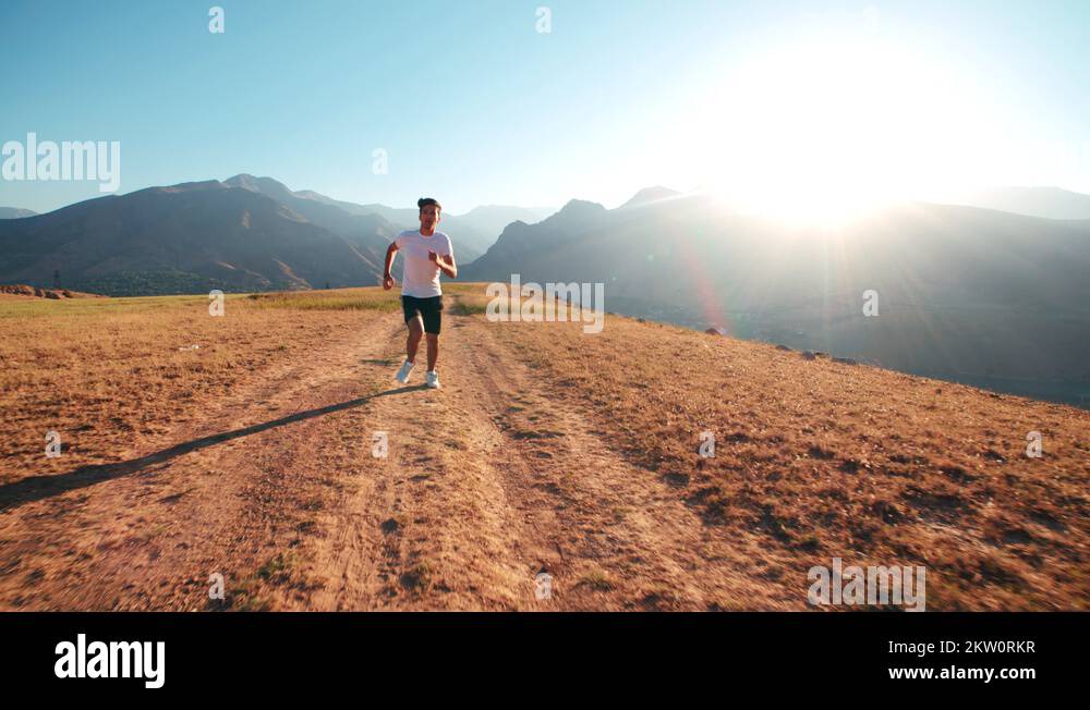 mountain landscape Asian running man Jogging in the morning slow motion ...