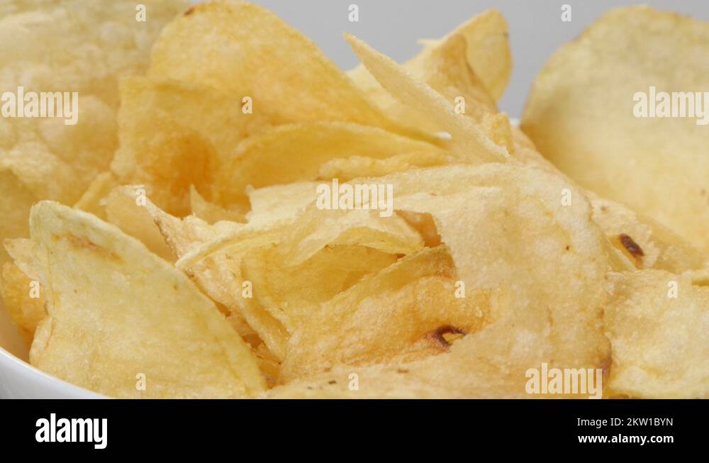Thin salted crisps appetizer food background slow tilt Stock Video ...