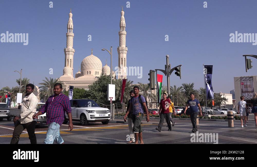 Arabs Pedestrian crossing street in Dubai, Muslim religion mosque ...