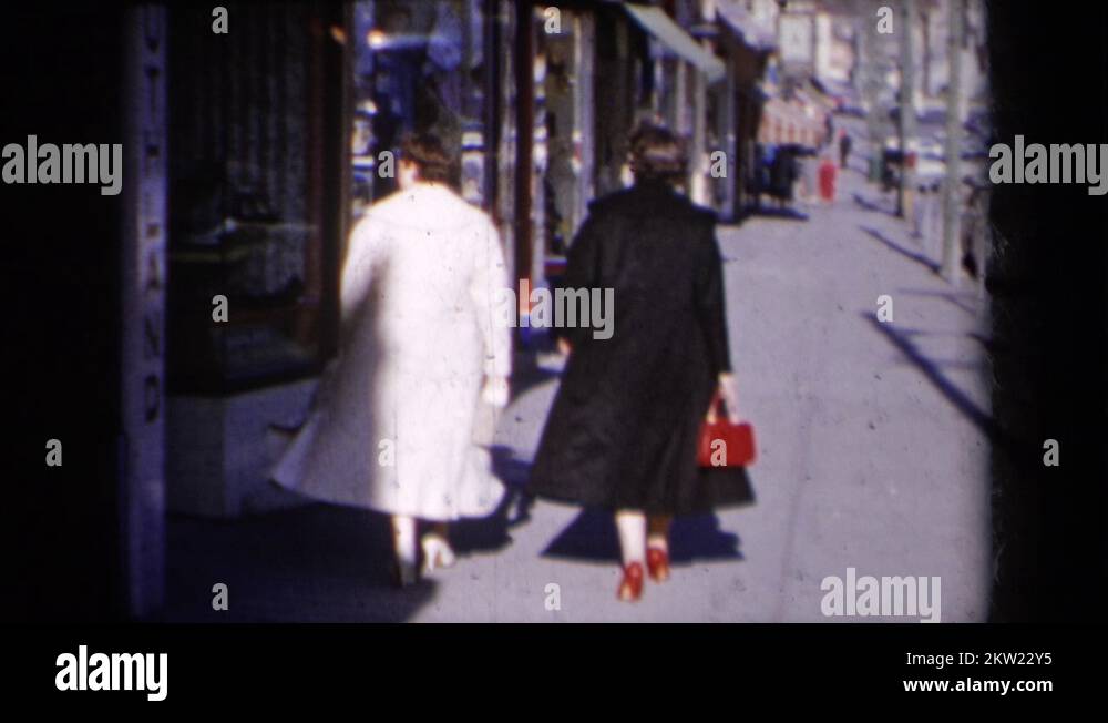 1959: women walking with dresses with a child busy area NEW YORK Stock ...