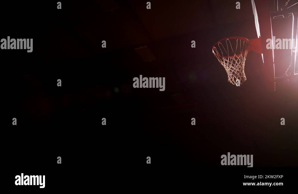 Two basketball players jump up and slam dunk, view from below Stock ...