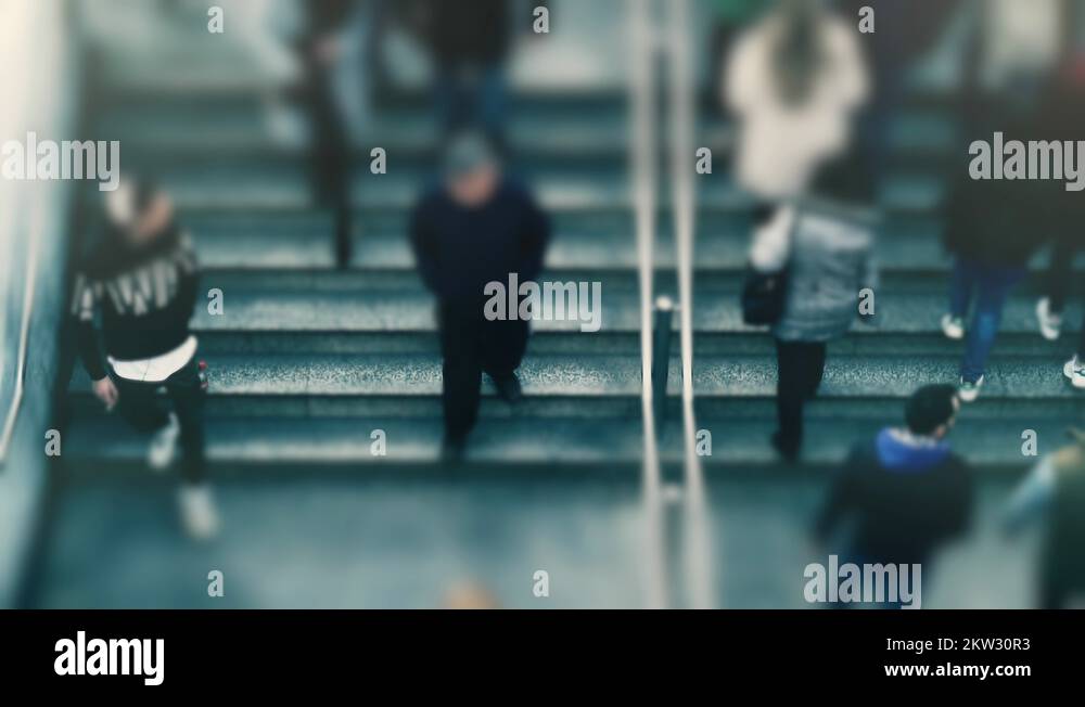 Birds eye view, dolly slow motion, anonymous crowd of people walk ...