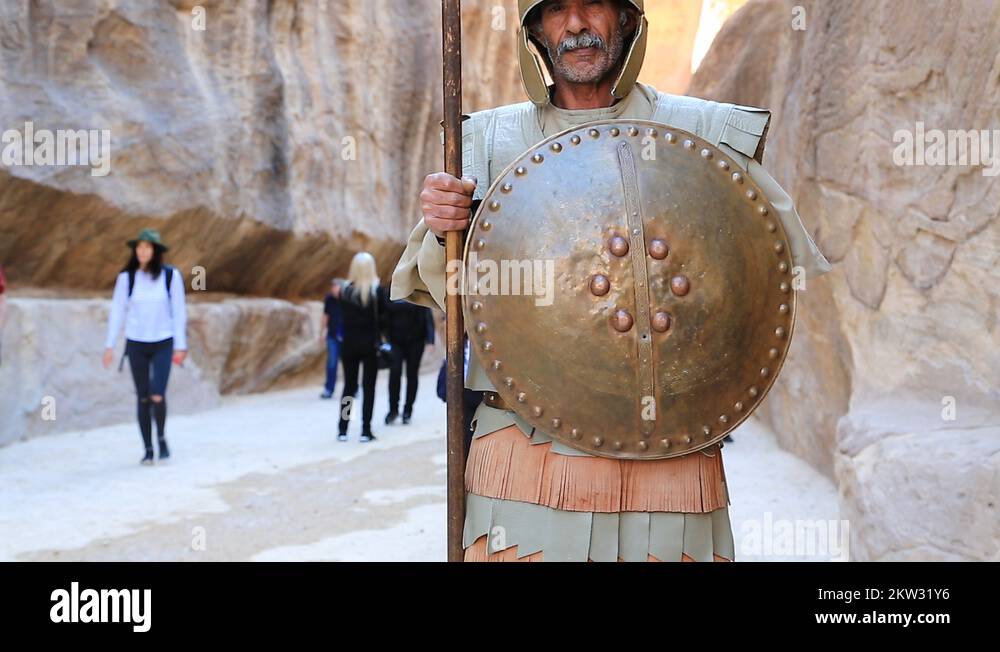 People in gorge that leads to Red Rose City Of Petra in Jordan Stock ...