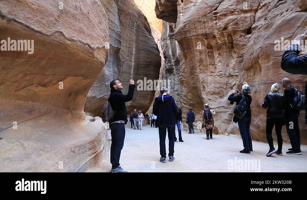 People in gorge that leads to Red Rose City Of Petra in Jordan Stock ...