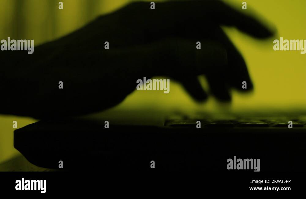 Nervous male hand typing fast in the darkness Stock Video Footage - Alamy