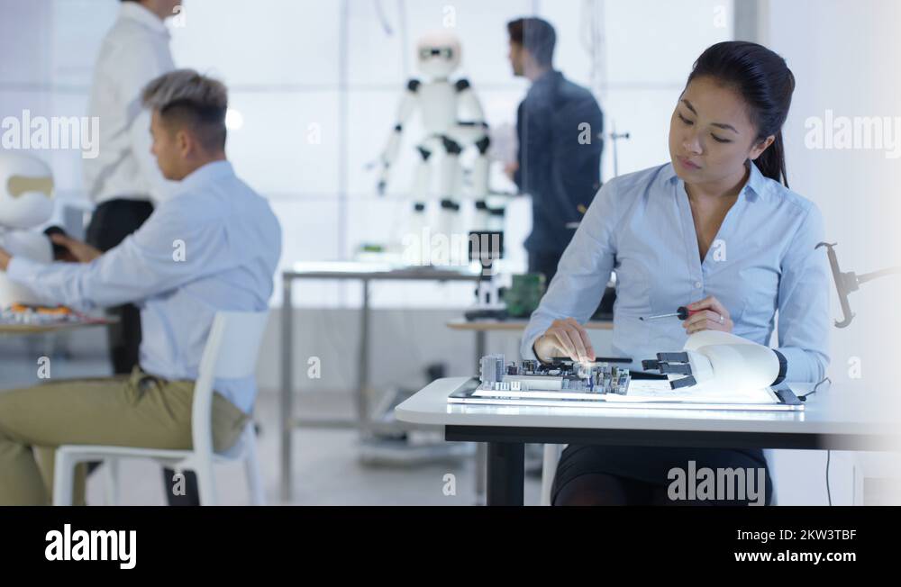 4K Technical design team working on construction of robot in modern lab ...