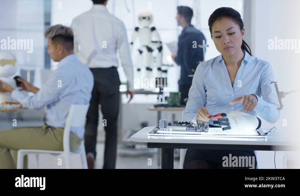 4K Technical design team working on construction of robot in modern lab ...
