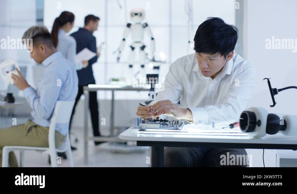 4K Technical design team working on construction of robot in modern lab ...