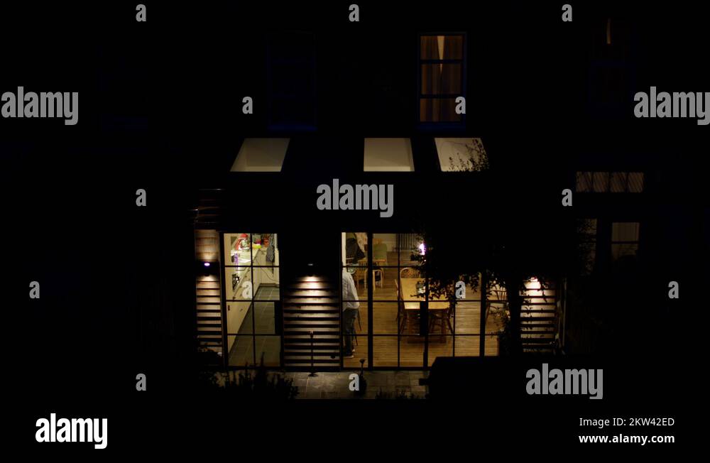 4K Man locking up his city home & turning off the lights at night Stock ...