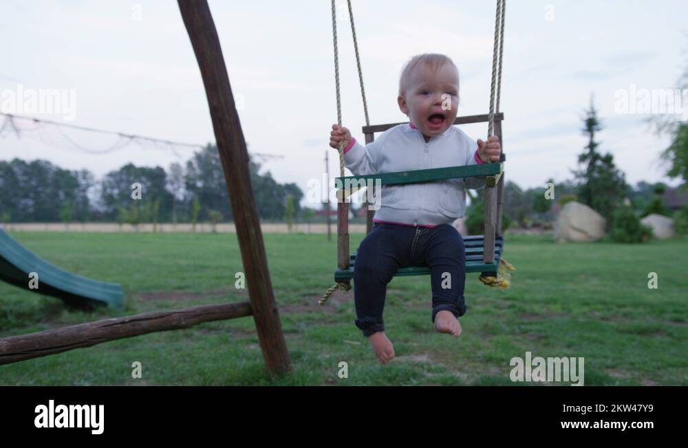 Baby Girl Shake Rock Kick Swing - 4k - Slow motion Stock Video Footage ...