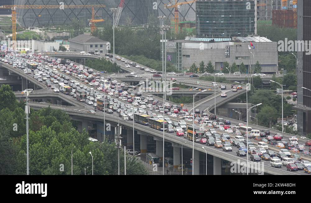 Heavy traffic flyover in business district Beijing, smog air pollution ...