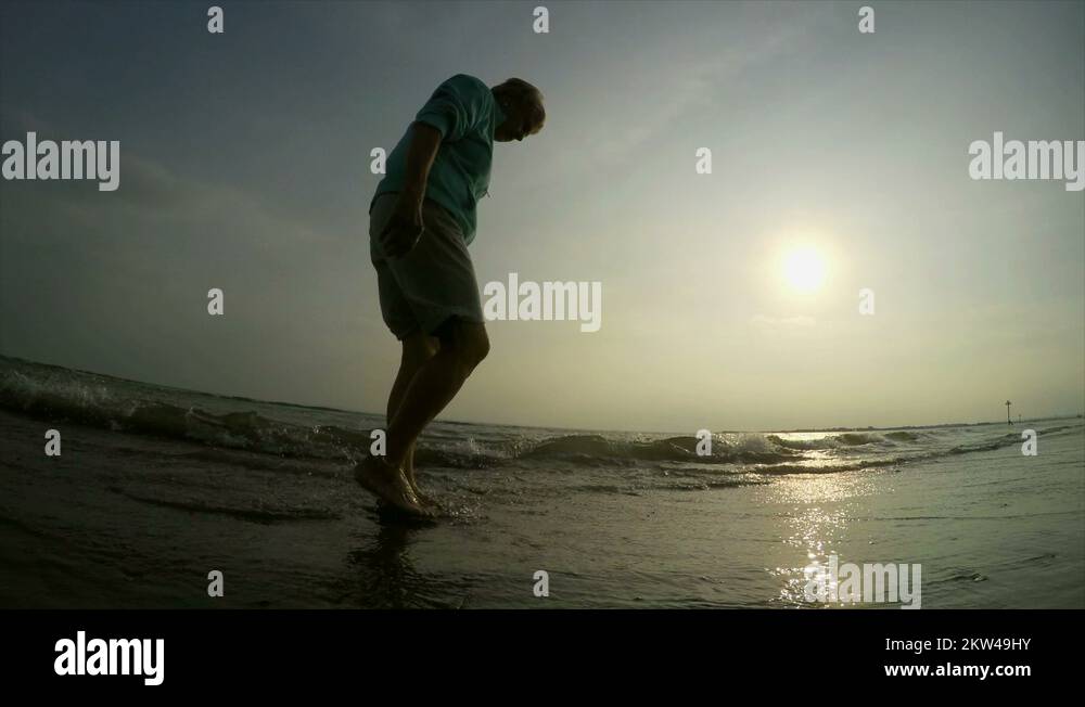 Woman wading in sea Stock Videos & Footage - HD and 4K Video Clips - Alamy