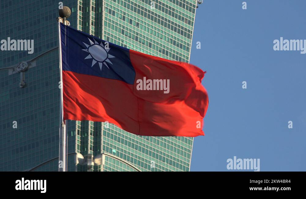 The Taiwanese national flag in front of the iconic Taipei 101 building ...