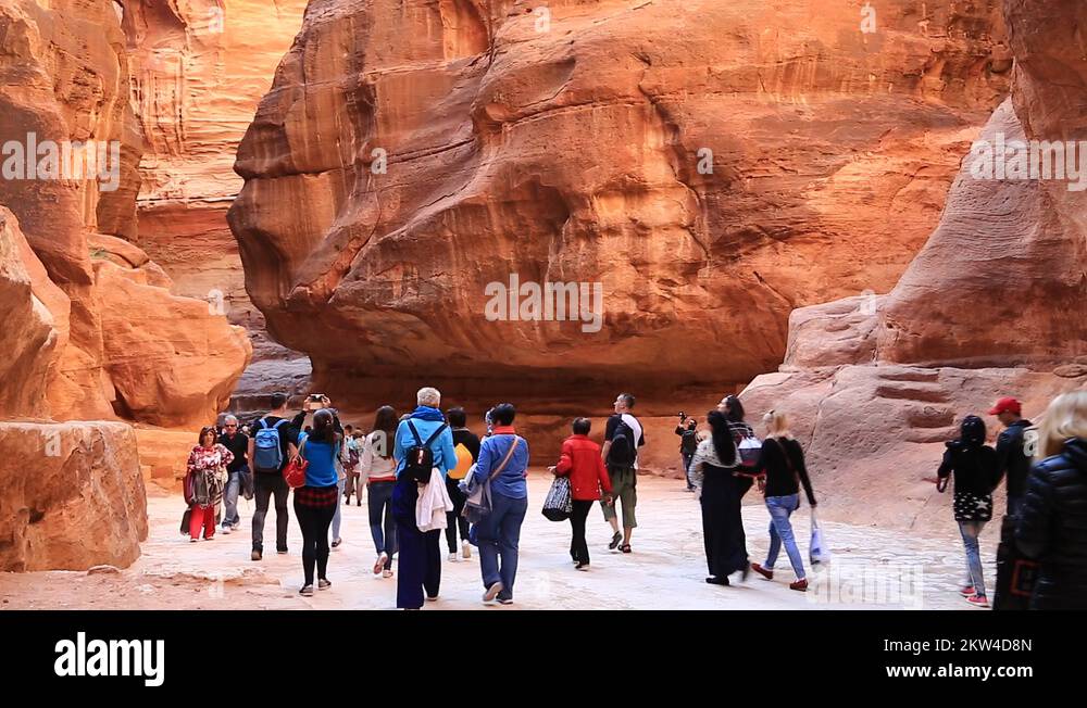 People in gorge that leads to Red Rose City Of Petra in Jordan Stock ...