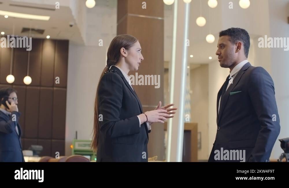 Meeting coworkers in hotel lobby Stock Videos & Footage - HD and 4K ...