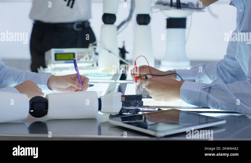 4K Technical design team collaborating on construction of robot in ...