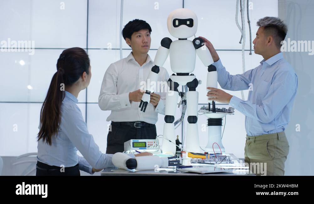 4K Technical design team collaborating on construction of robot in ...
