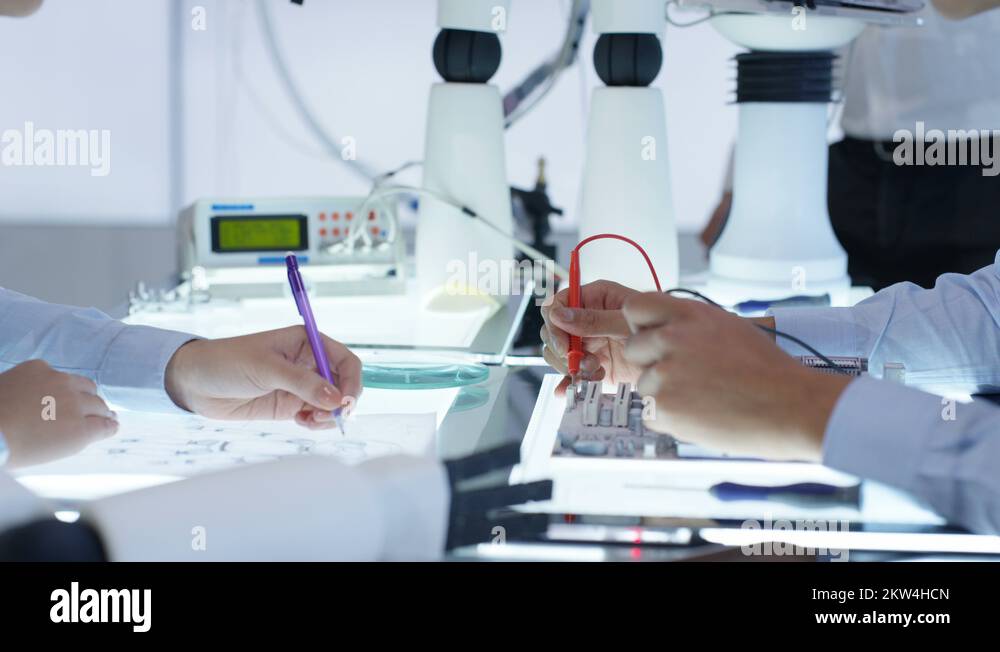 4K Technical design team collaborating on construction of robot in ...