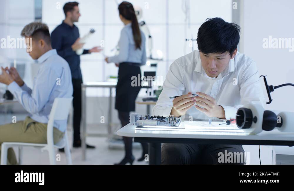 4K Technical design team working on construction of robot in modern lab ...