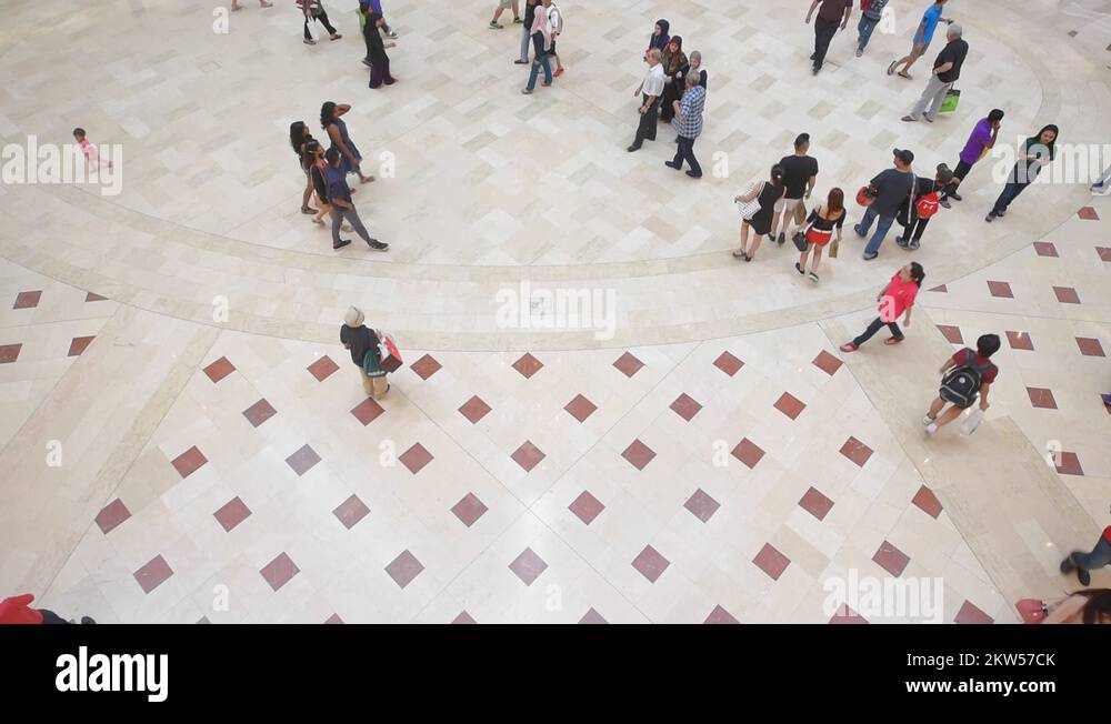 people walk inside Suria KLCC shopping mall, Malaysia, top view Stock ...