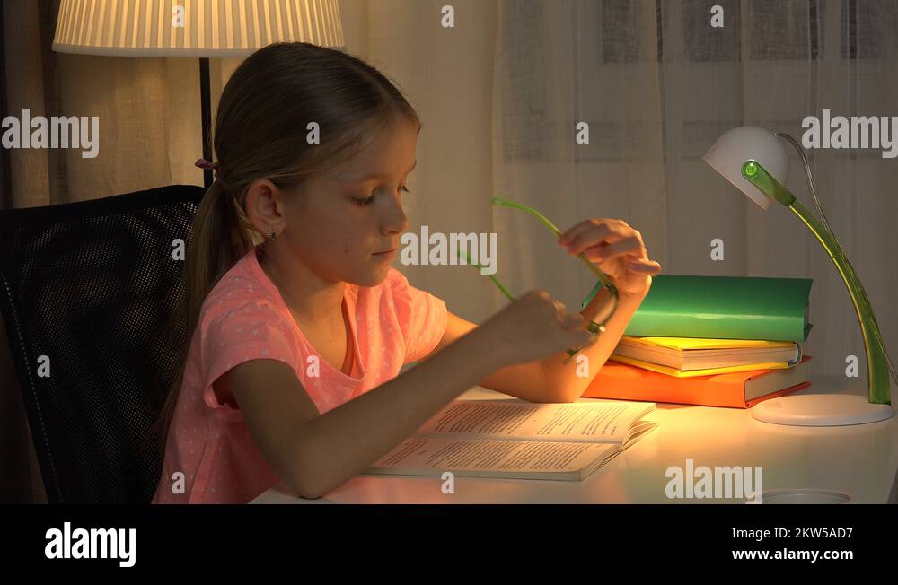 Eyeglasses Child Reading Book, Girl Studying at Desk Lamp, Learning Children 4K Stock Video ...