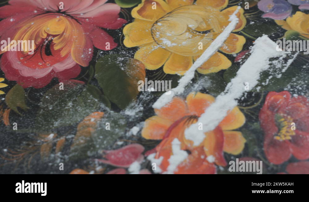 Man sniffing white powder narcotic directly from the patterned tray ...