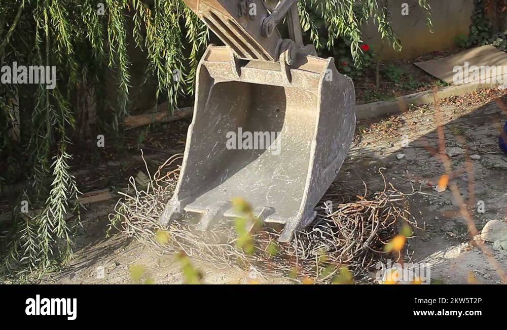 Operator turns scrap rebars into rolls in a demolition site Stock Video ...